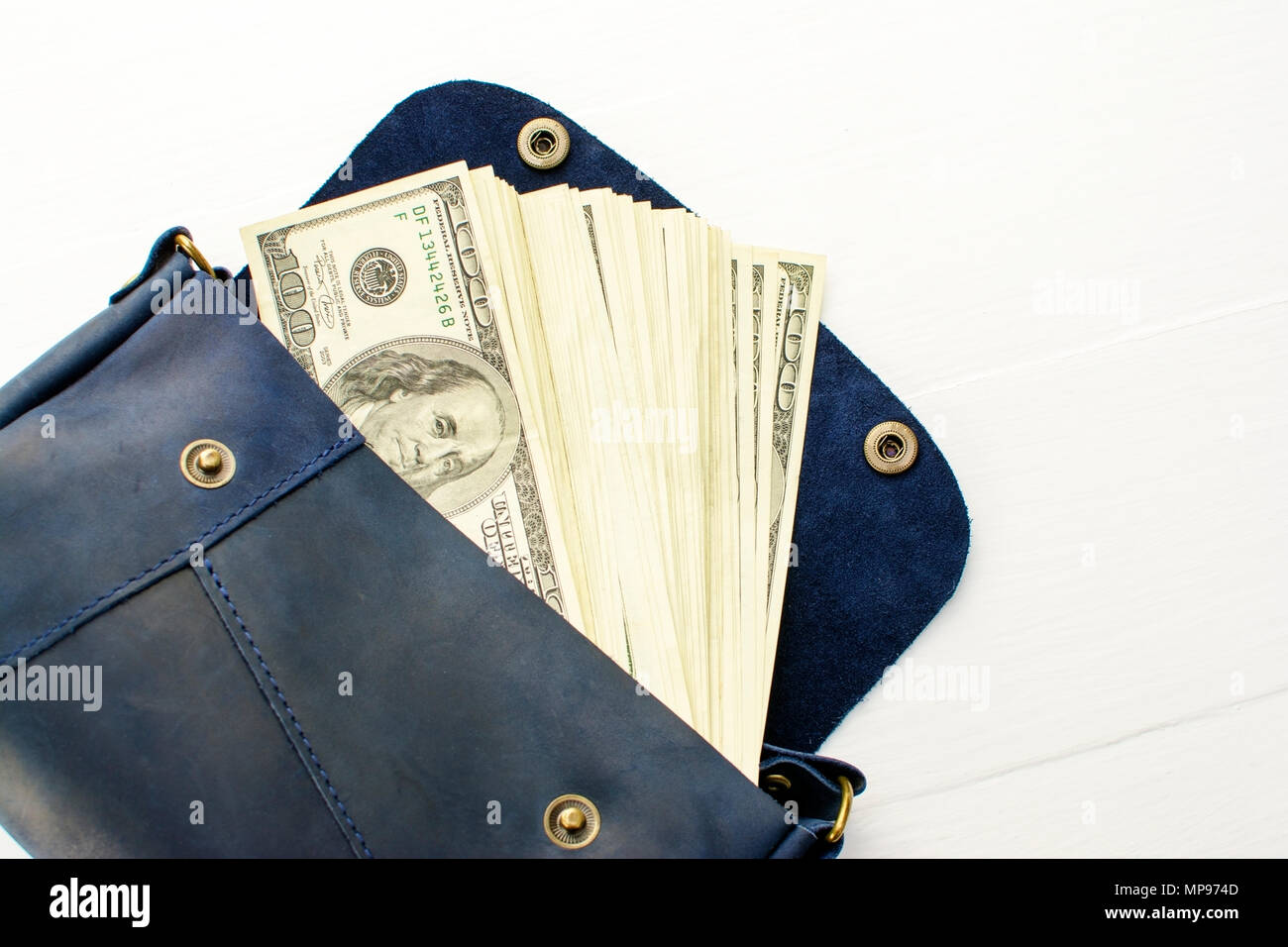 money in bag on white background Stock Photo - Alamy