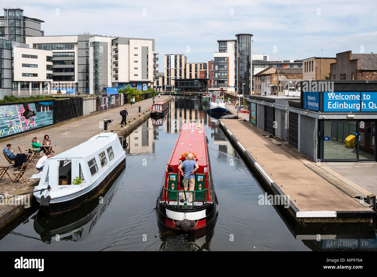 View of Union Canal at Lochrin Basin with narrow boat sailing to ...