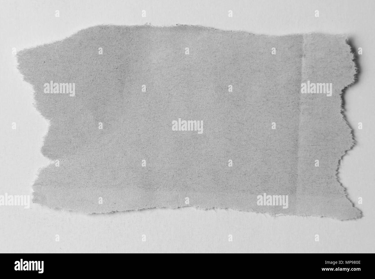 Piece of torn paper on plain background Stock Photo - Alamy