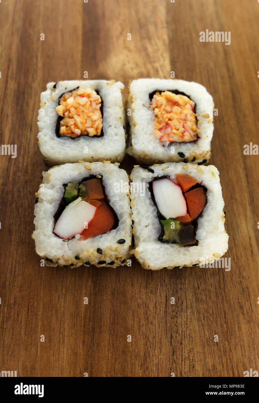 Top View of sushi rolls on a wood background Stock Photo - Alamy