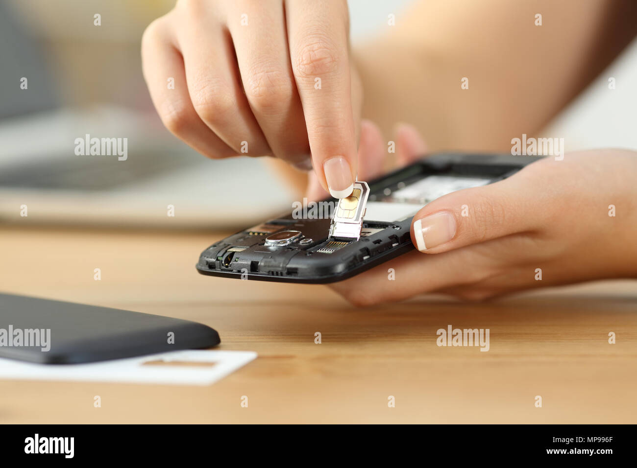 Removing sim hi-res stock photography and images - Alamy