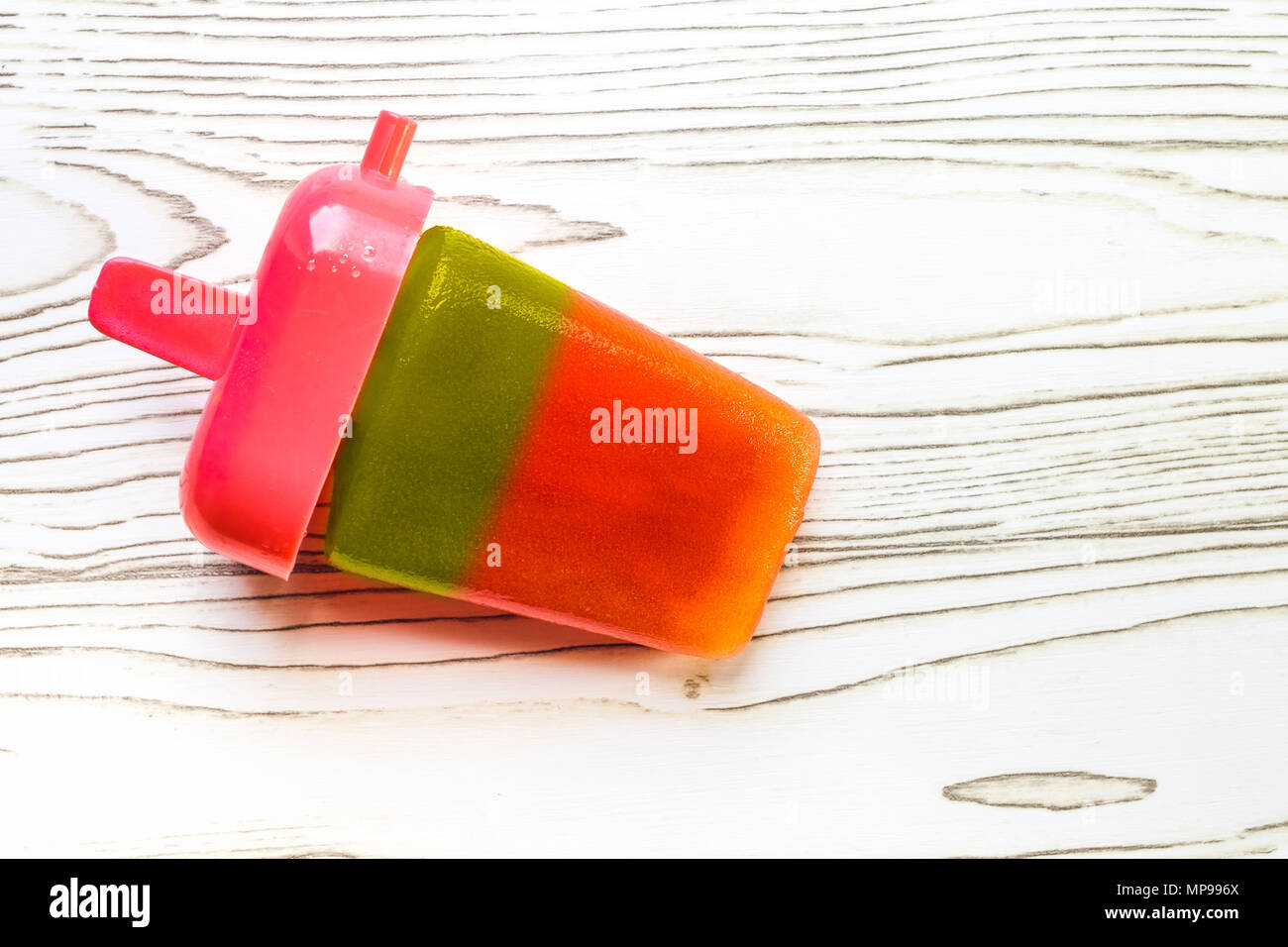 Homemade red and green watermelon popsicle on wooden backdrop Stock ...