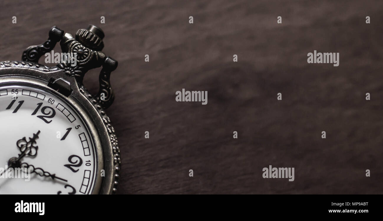 old vintage pocket watch showing time on wooden background Stock Photo ...