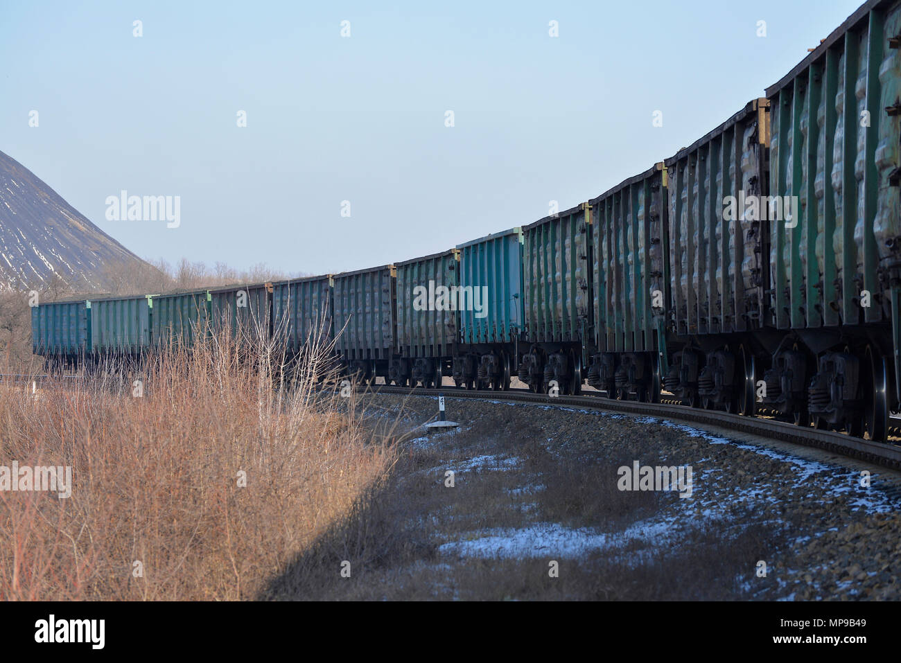 Freight train wagons on a winter frosty day in the background of ...