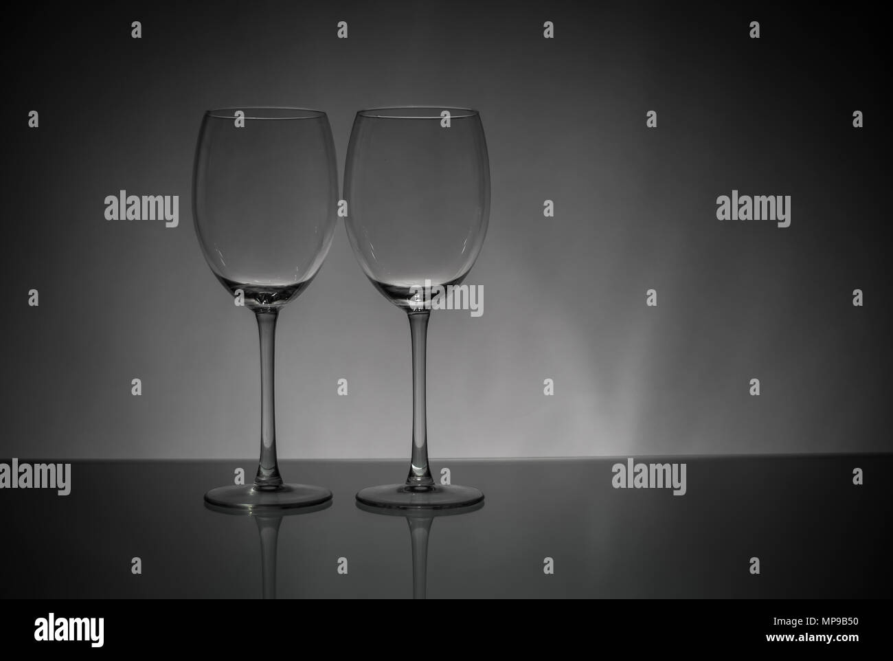 Two empty glasses stand on the table Stock Photo - Alamy
