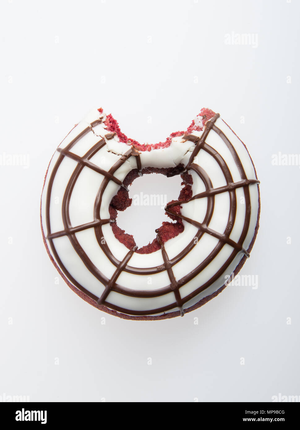 donut or donut with missing bite on a background Stock Photo - Alamy