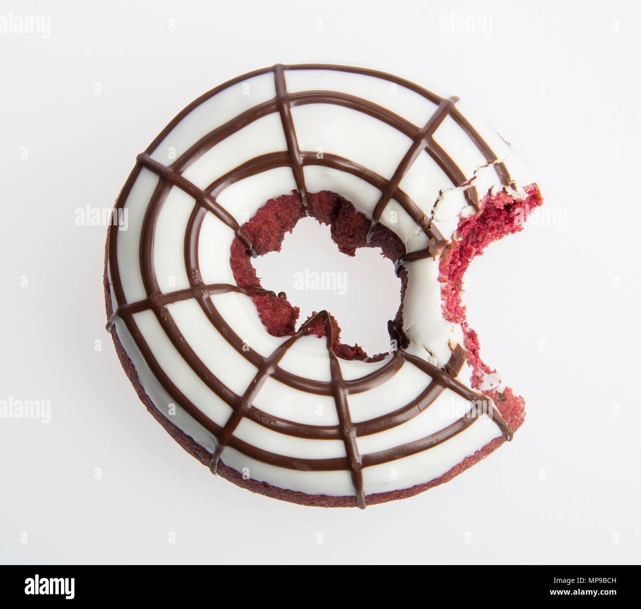 donut or donut with missing bite on a background Stock Photo - Alamy