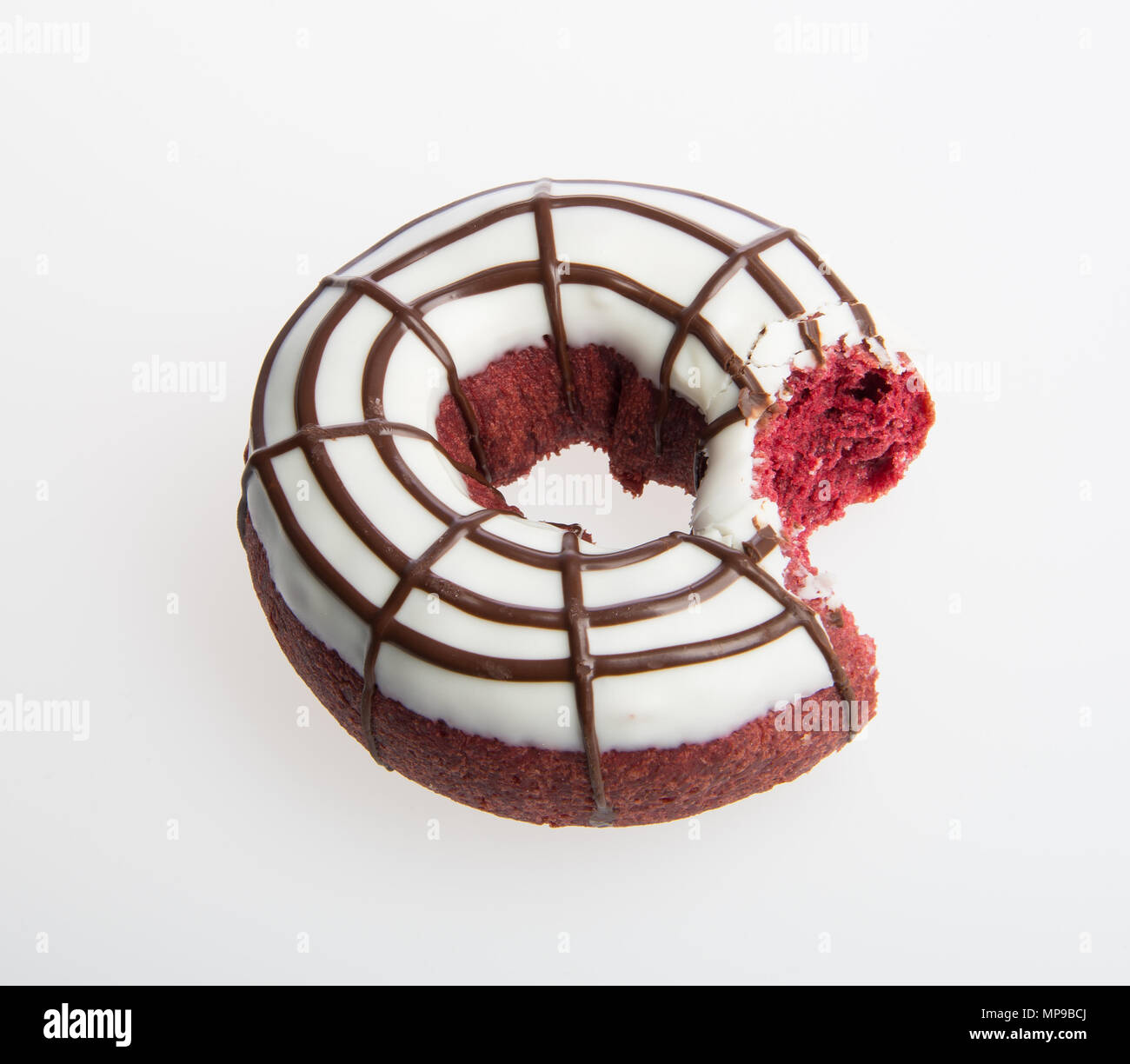 donut or donut with missing bite on a background Stock Photo - Alamy