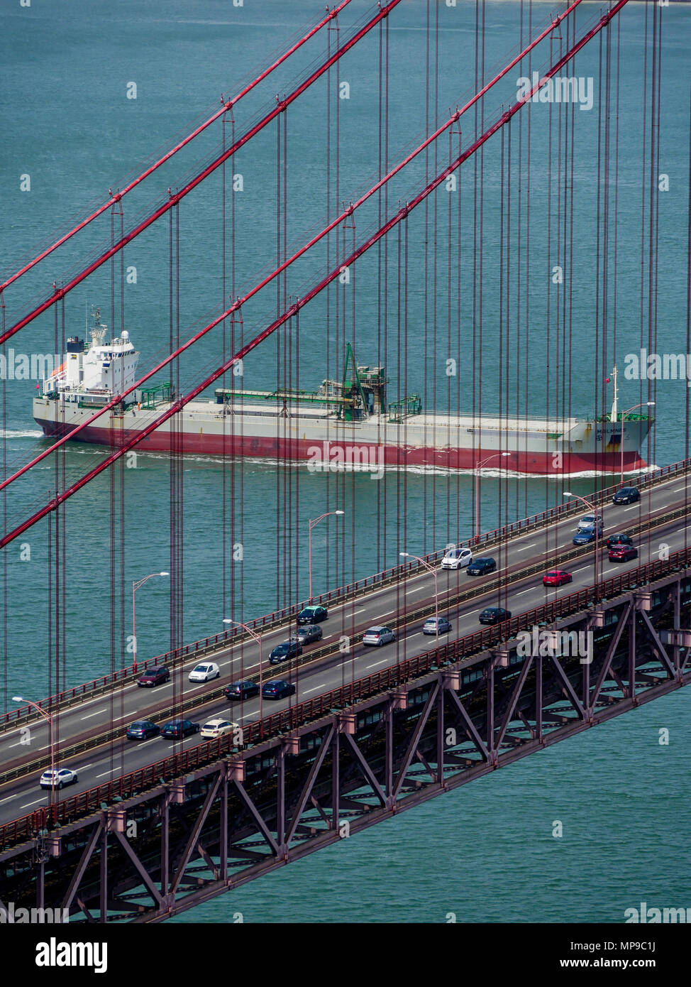 Big ship sails under bridge hi-res stock photography and images - Alamy