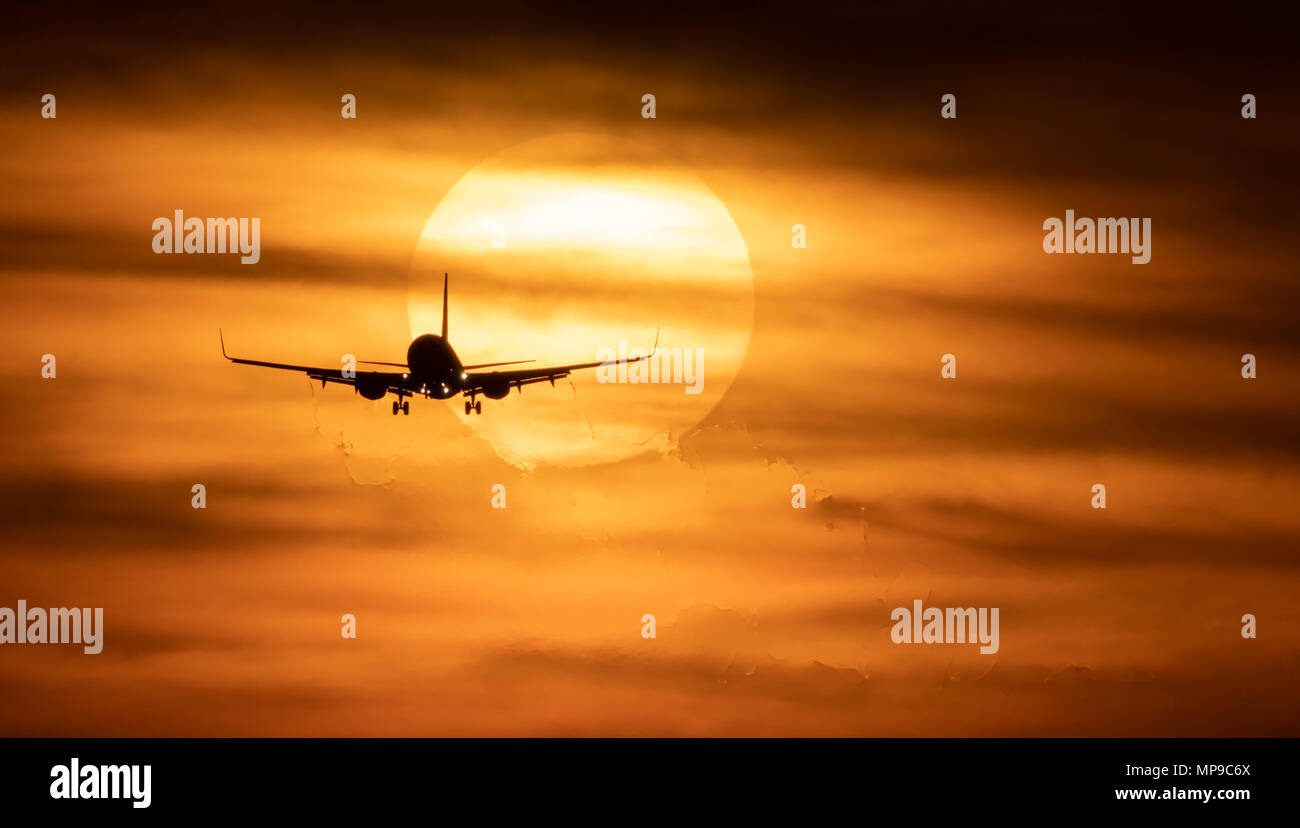 Beautiful sunset with airplane hi-res stock photography and images - Alamy