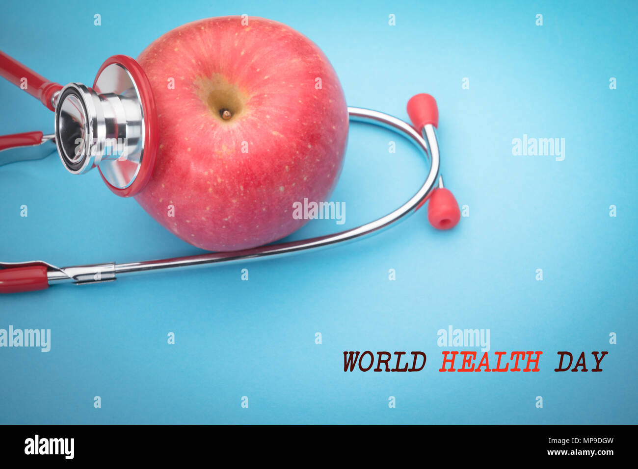 world health day healthcare and medicine stethoscope and red apple ...