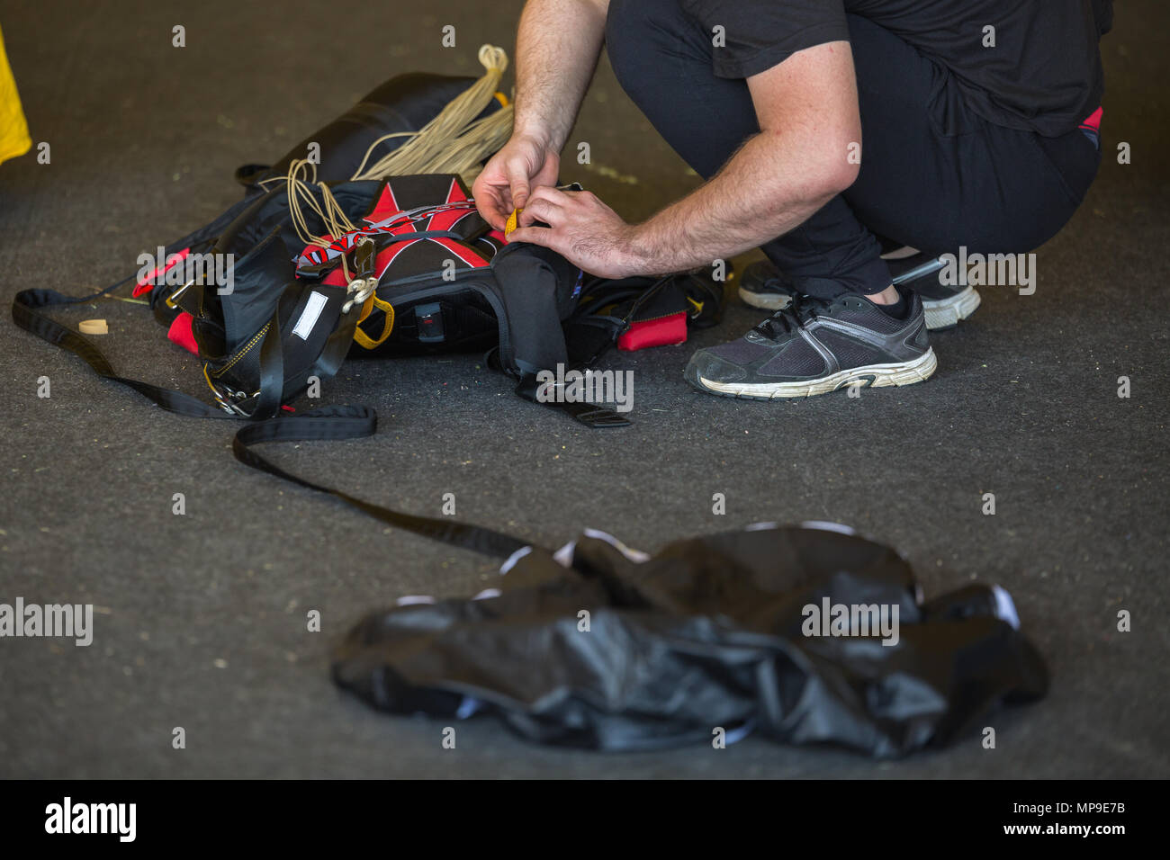 Skydiver Packing His Black Parachute in the Aerodrome Room Stock Photo ...