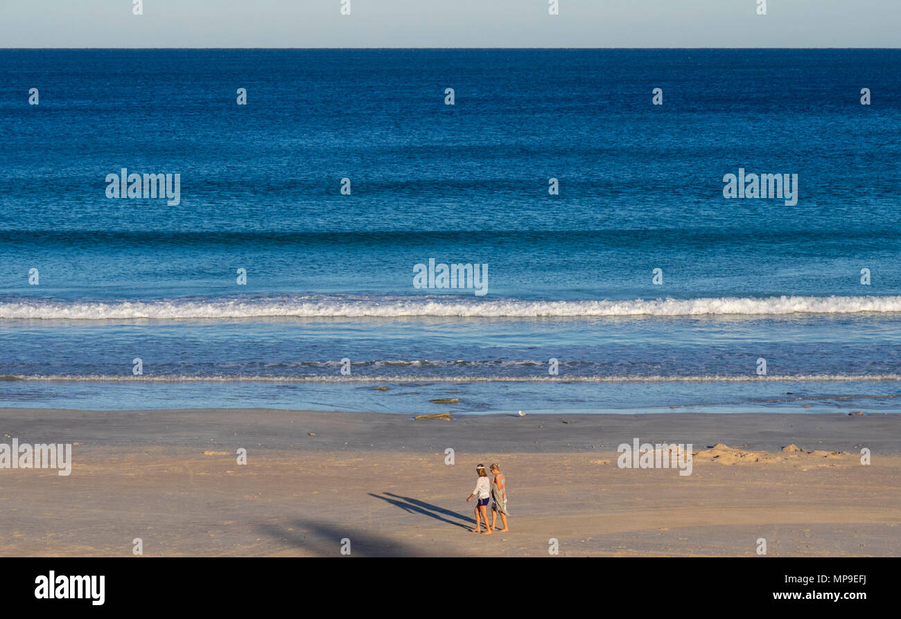 Woman walking along beach australia hi-res stock photography and images ...