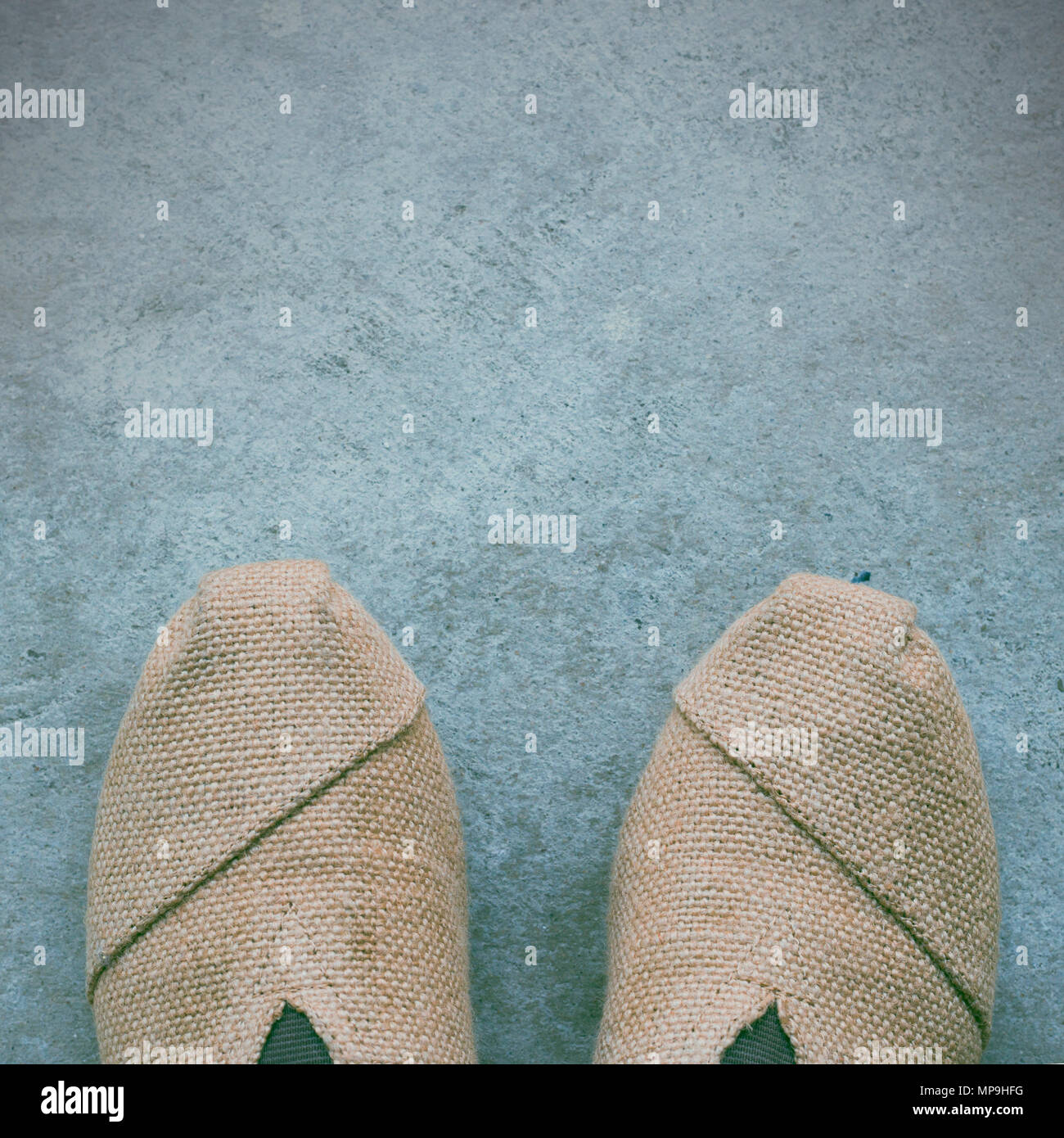 Women shoes on the cement floor background Stock Photo - Alamy