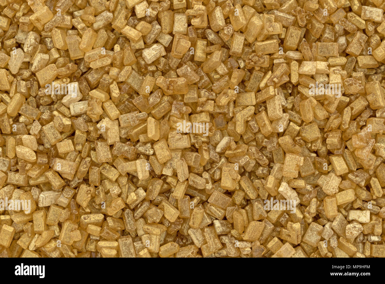 Very close view of glazed gold sugar Stock Photo - Alamy