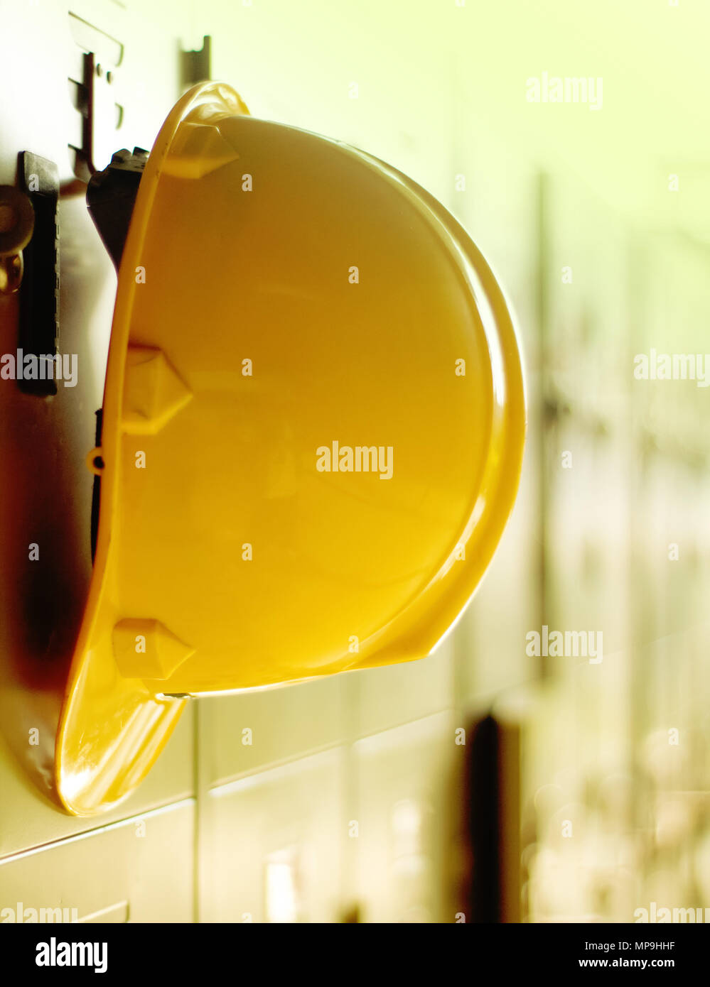 Safety helmet hanging on locker for worker equipment Stock Photo - Alamy