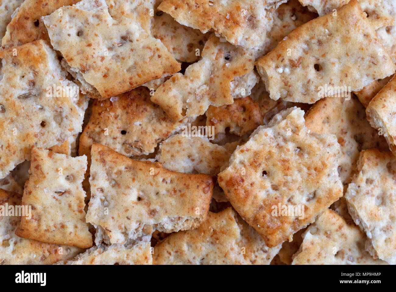 Top close view of broken multigrain flatbread crackers Stock Photo - Alamy
