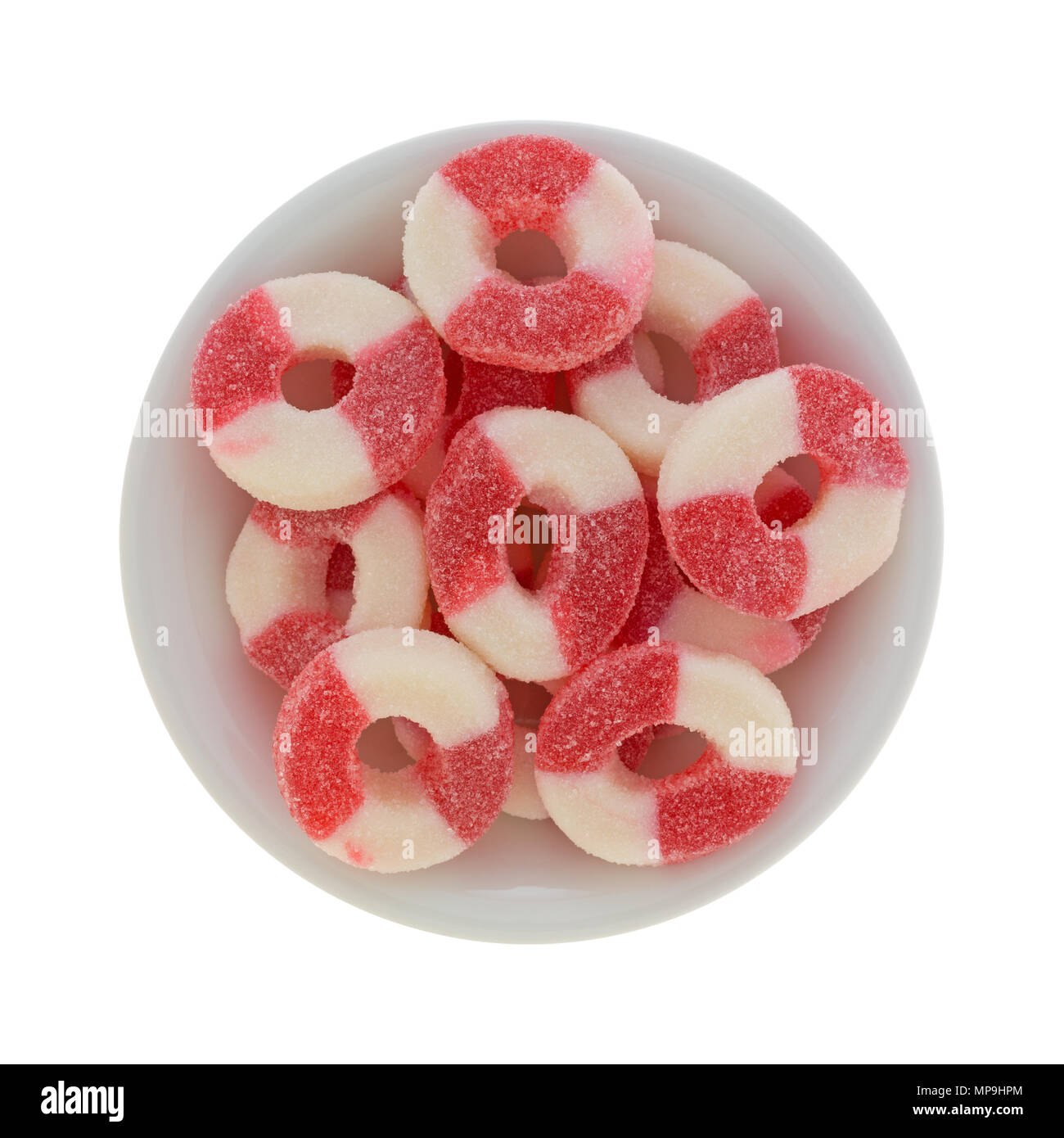 Top view of a small bowl filled with white and red cherry flavored ...