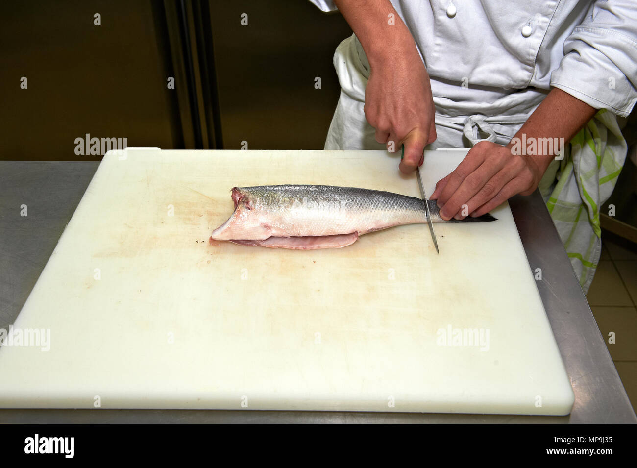 the cleaning of the sea bass Stock Photo - Alamy