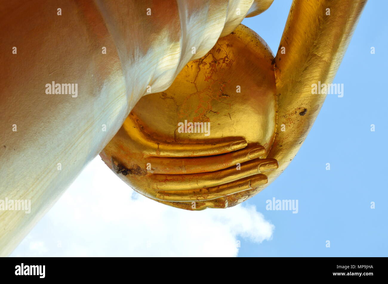golden Buddha hand hold an alms bowl Stock Photo - Alamy