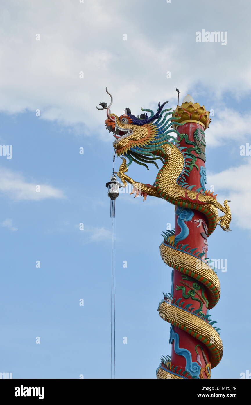 Chinese dragon statue roll over the pole Stock Photo - Alamy