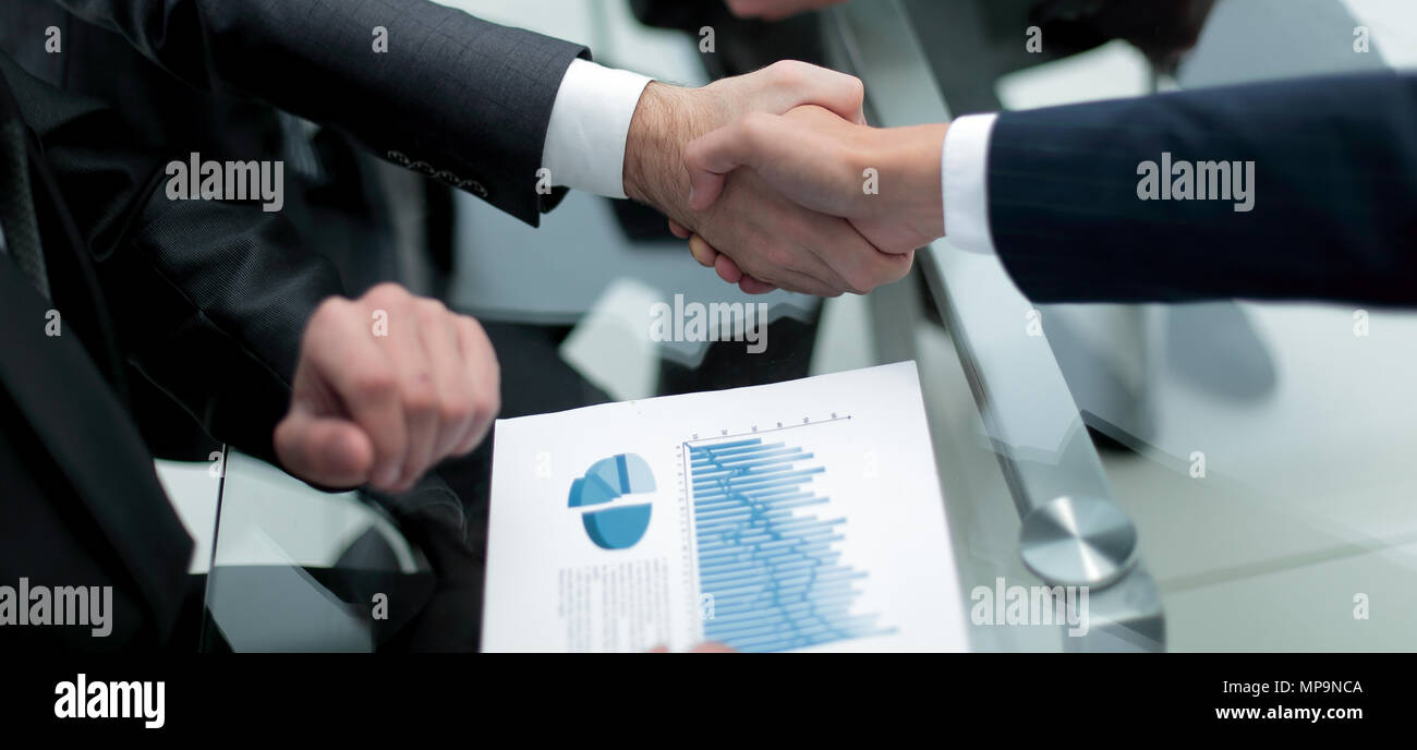 close up. investor and businessman shaking hands Stock Photo - Alamy