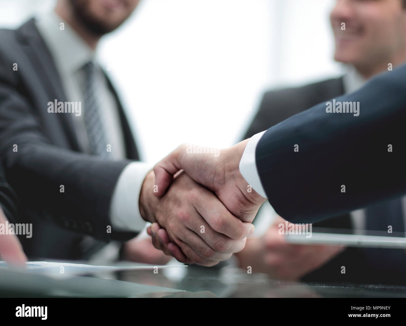 Close-up image of a firm handshake Stock Photo - Alamy