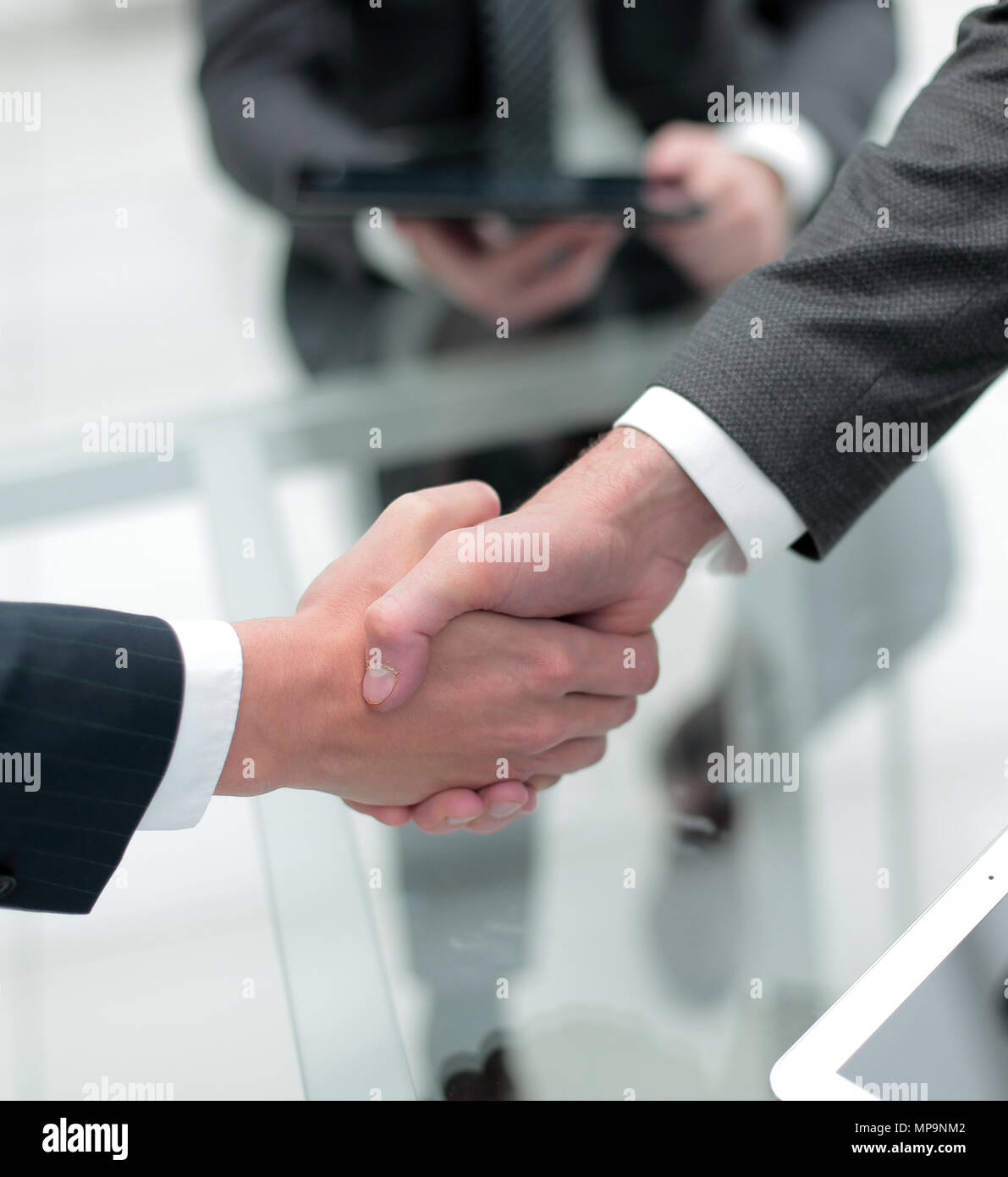 close up.financial partners handshake Stock Photo - Alamy