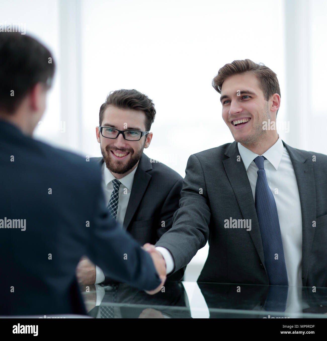 close up.businessman welcomes new business partner Stock Photo - Alamy