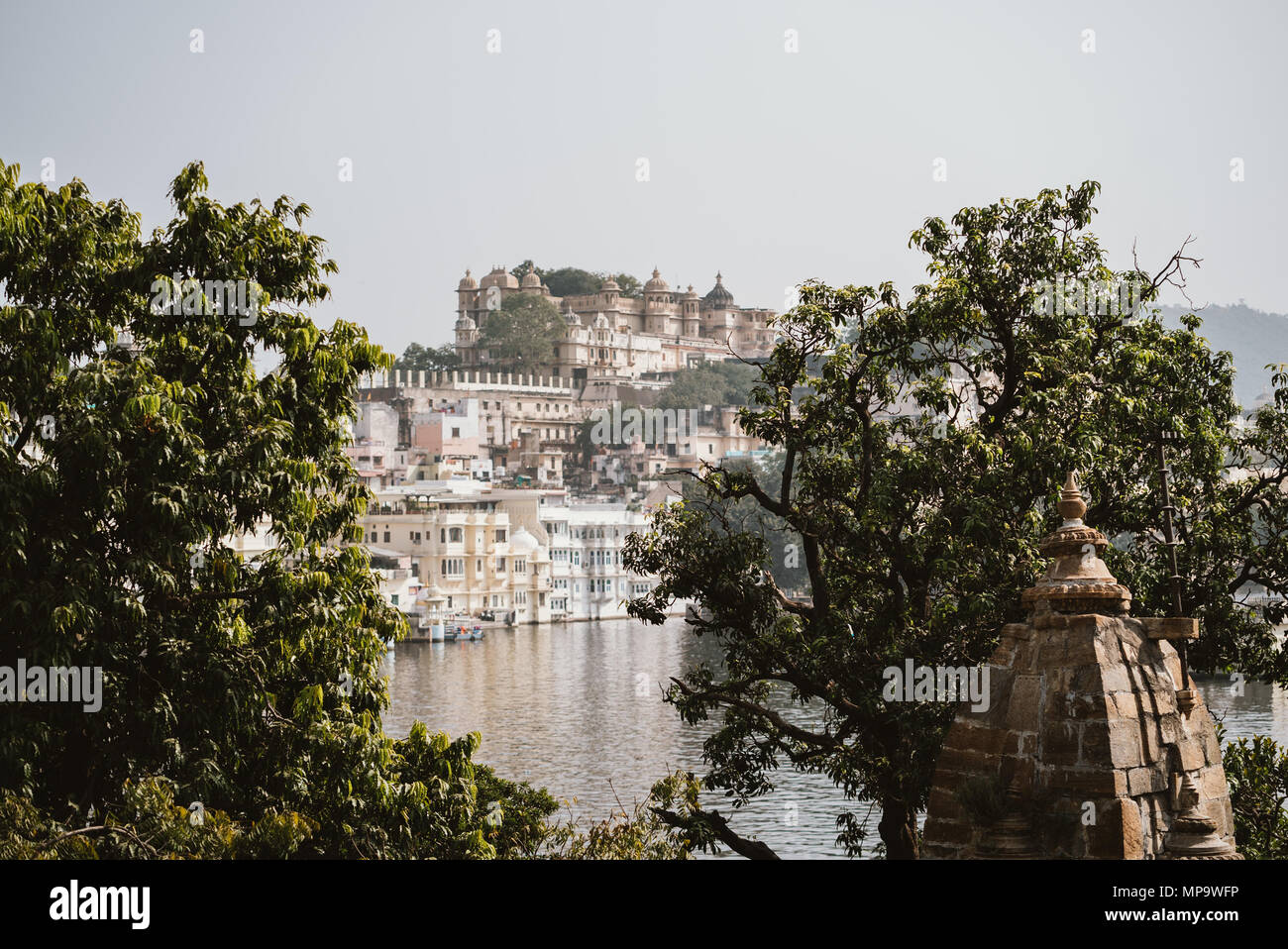view through the trees of a beautiful city Udaipur, India Stock Photo ...