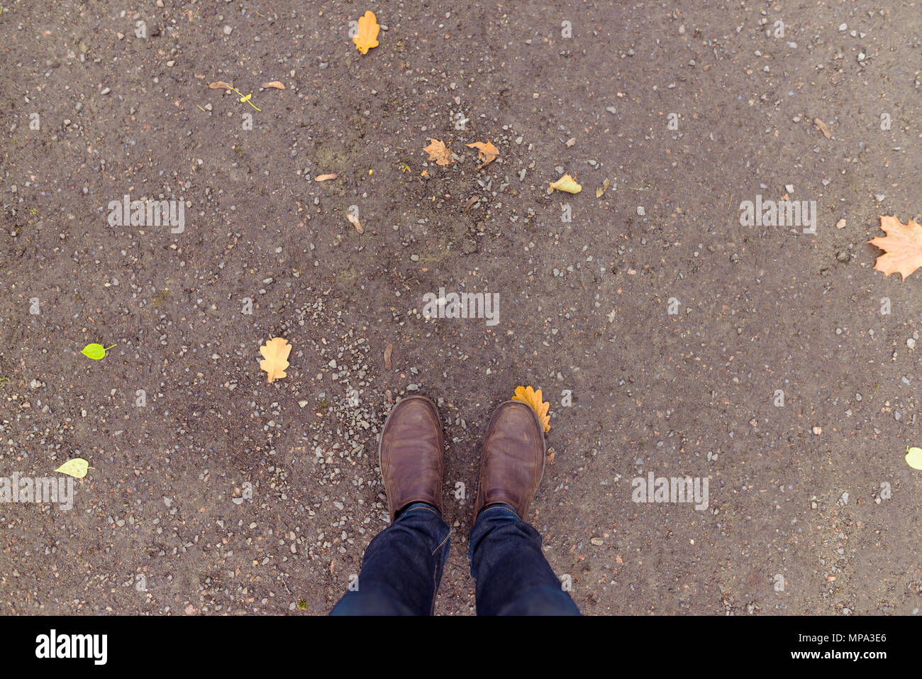 Overhead shot of man standing on concrete ground Stock Photo - Alamy