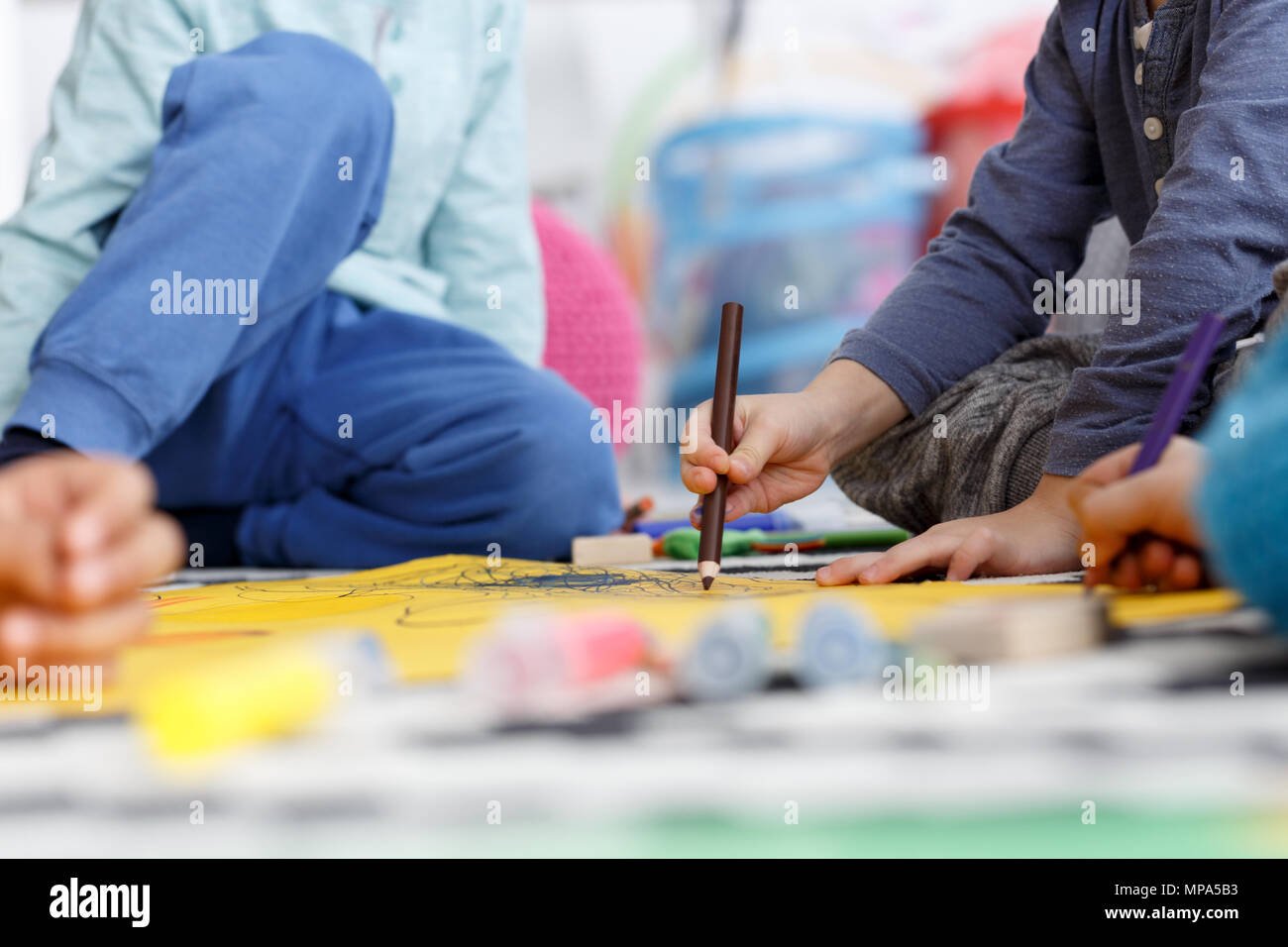 Close-up of group of kids drawing the picture during classes Stock ...