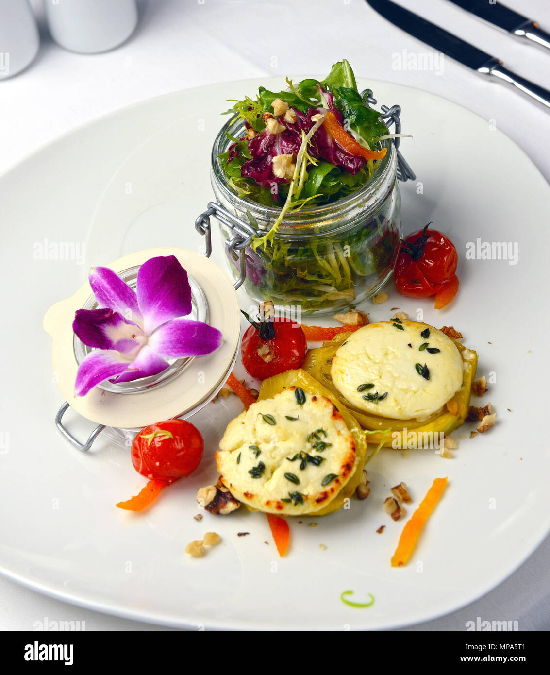 Goat cheese baked in fennel Stock Photo - Alamy