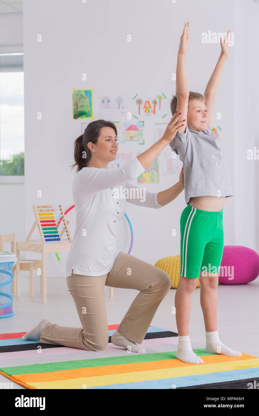 Shot of a little boy doing exercises with his physiotherapist Stock ...