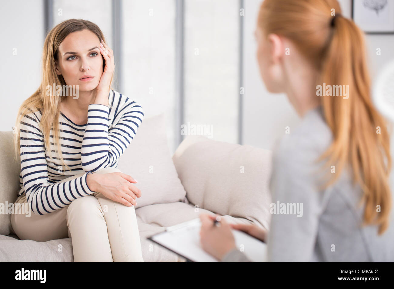 Mental health and counseling concept - psychologist listening to ...