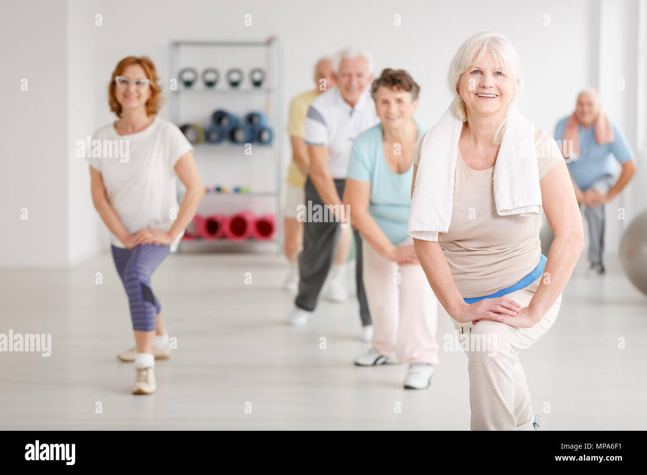 Elderly people exercising in a group in fitness club Stock Photo - Alamy