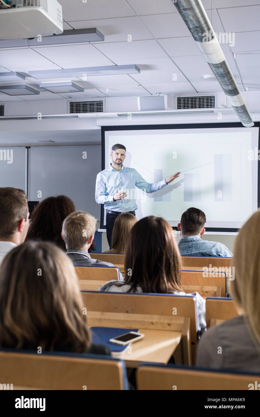 College teacher giving speech in lecture hall Stock Photo - Alamy