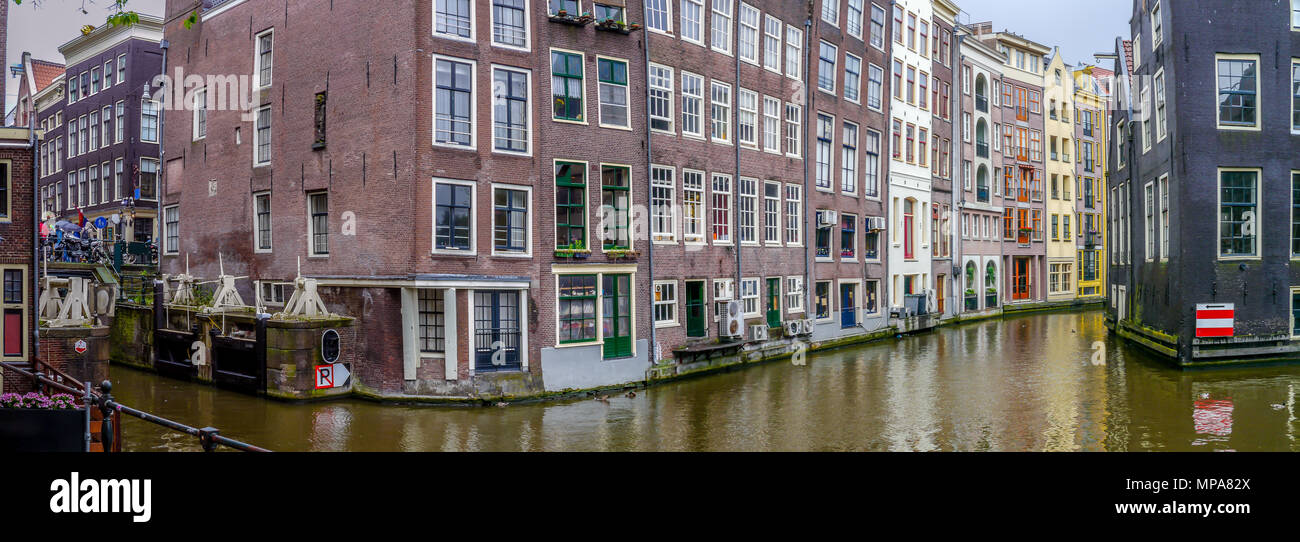 Canal corner in Amsterdam - where the old buildings seem to curve and ...