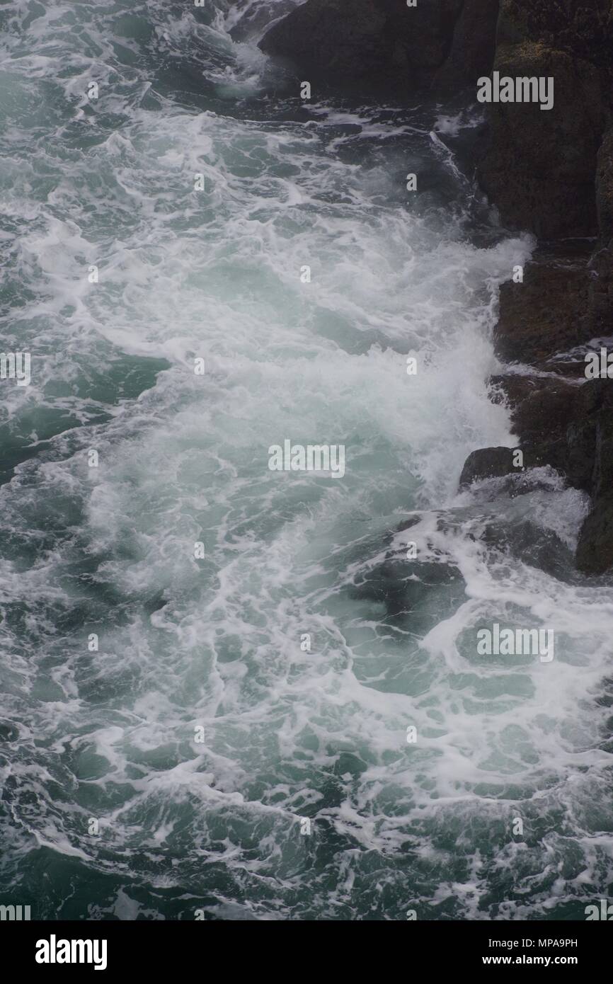 Intimate Seascape of Swirling Emerald Water around Rugged Sea Cliffs ...