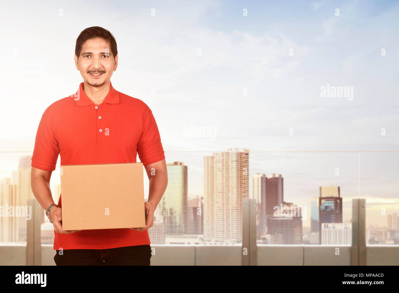 Delivery asian postman parcel box hi-res stock photography and images ...