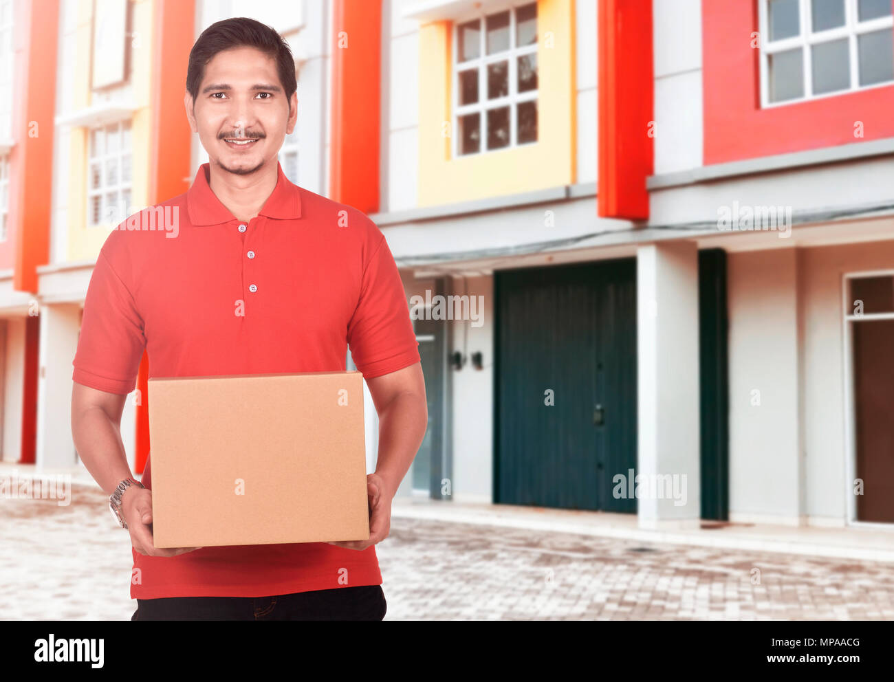 Delivery asian postman parcel box hi-res stock photography and images ...
