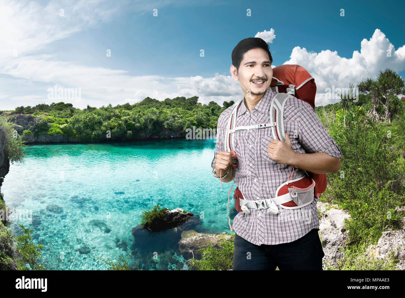 Cheerful asian backpacker enjoying nature at travel destination Stock ...