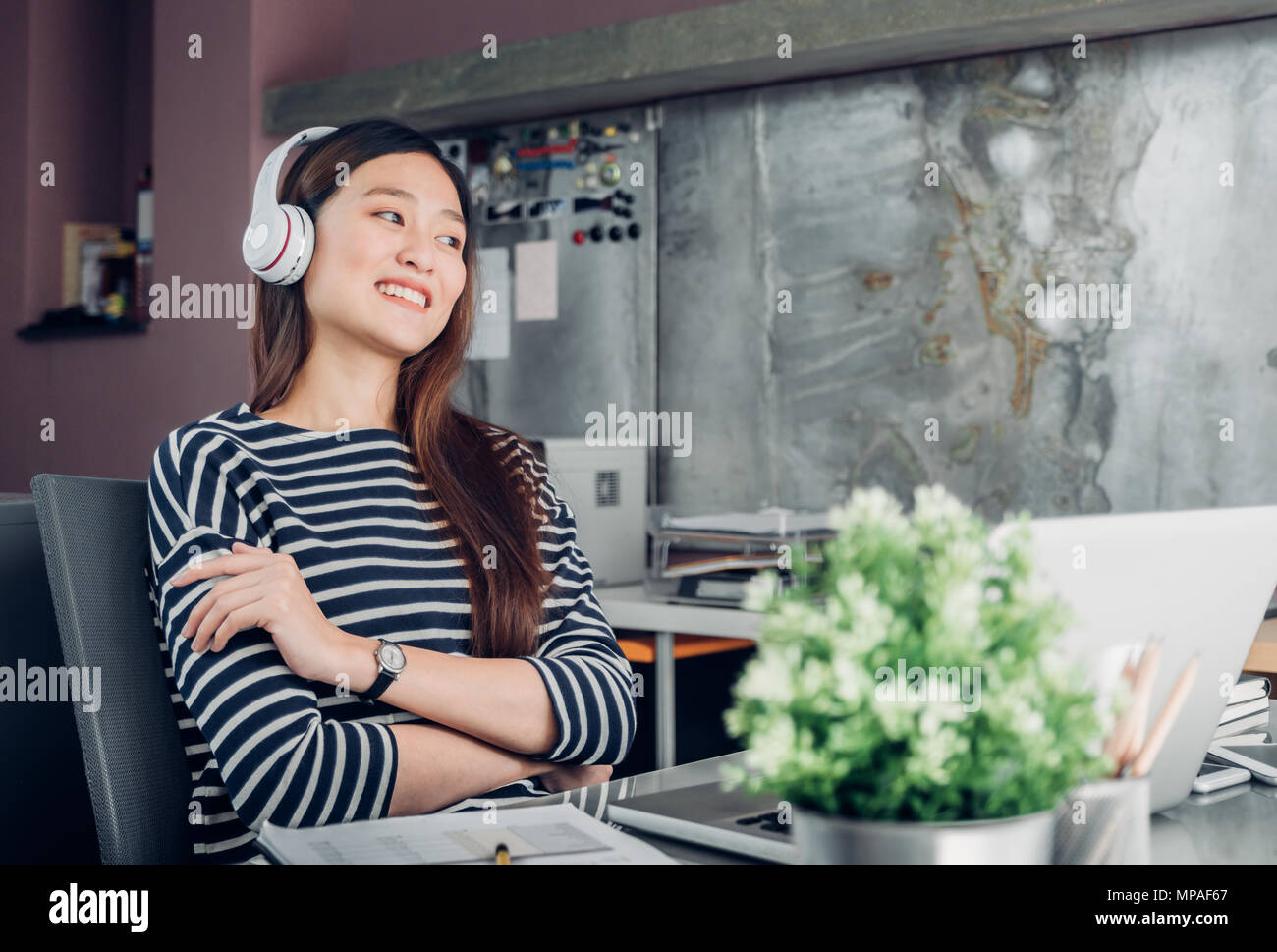 Young asian casual businesswoman arm on desk rest pose with laptop ...