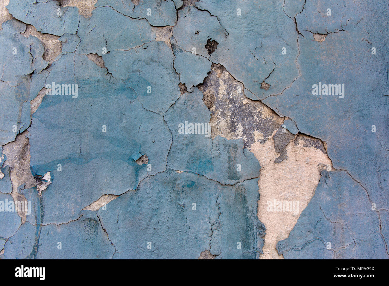 Blue paint peeling plaster gunge wall Stock Photo - Alamy