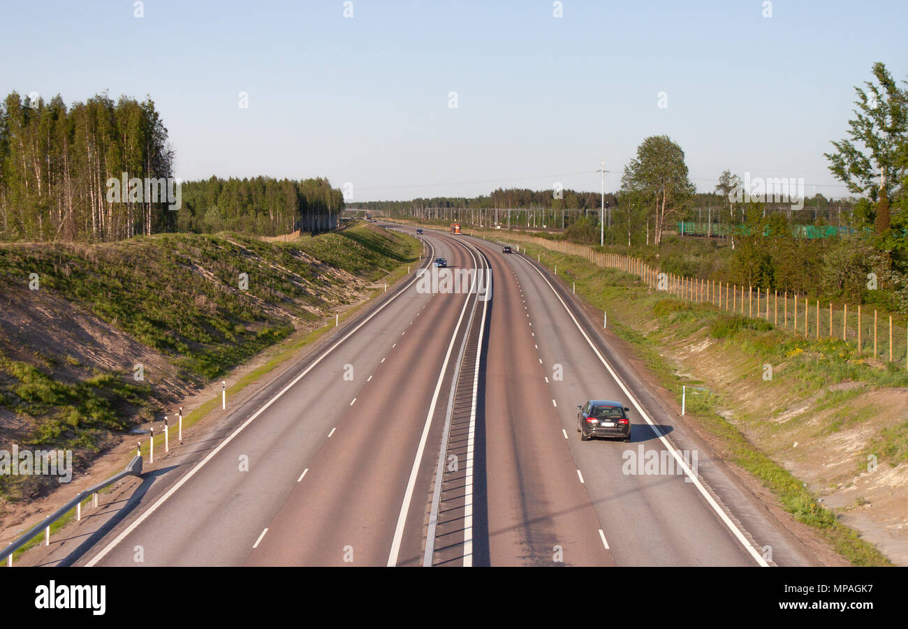 four-way road and bridge that crosses it Stock Photo - Alamy