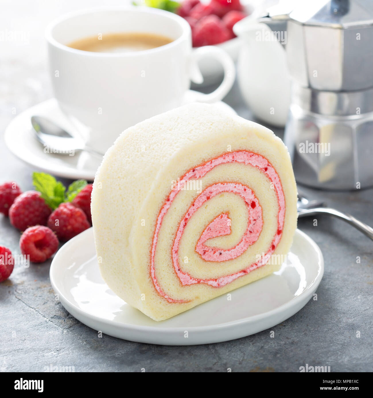 Vanilla roll cake with berry filling Stock Photo - Alamy
