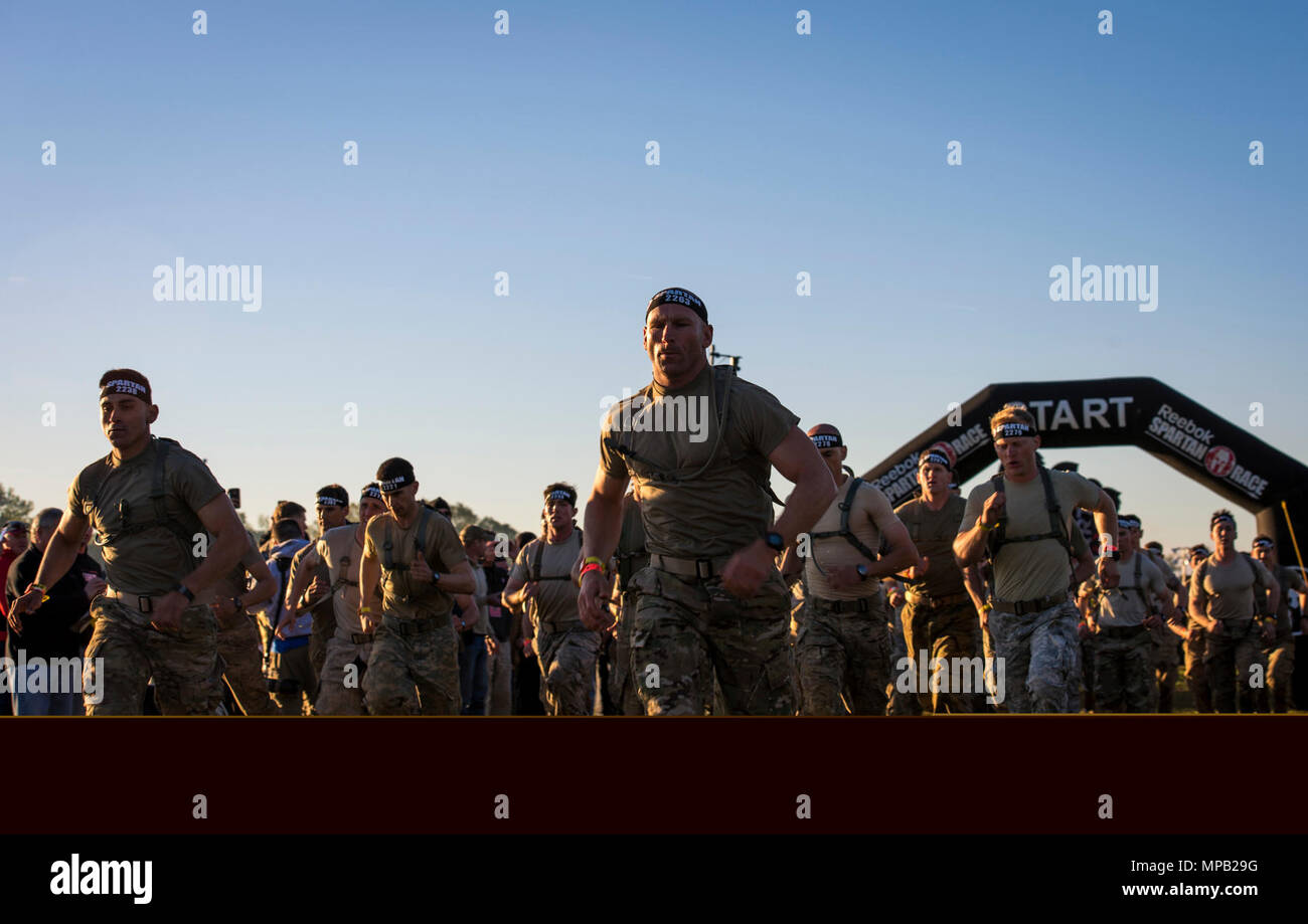 U.S. Army Rangers run from the starting line of a Spartan Race during ...
