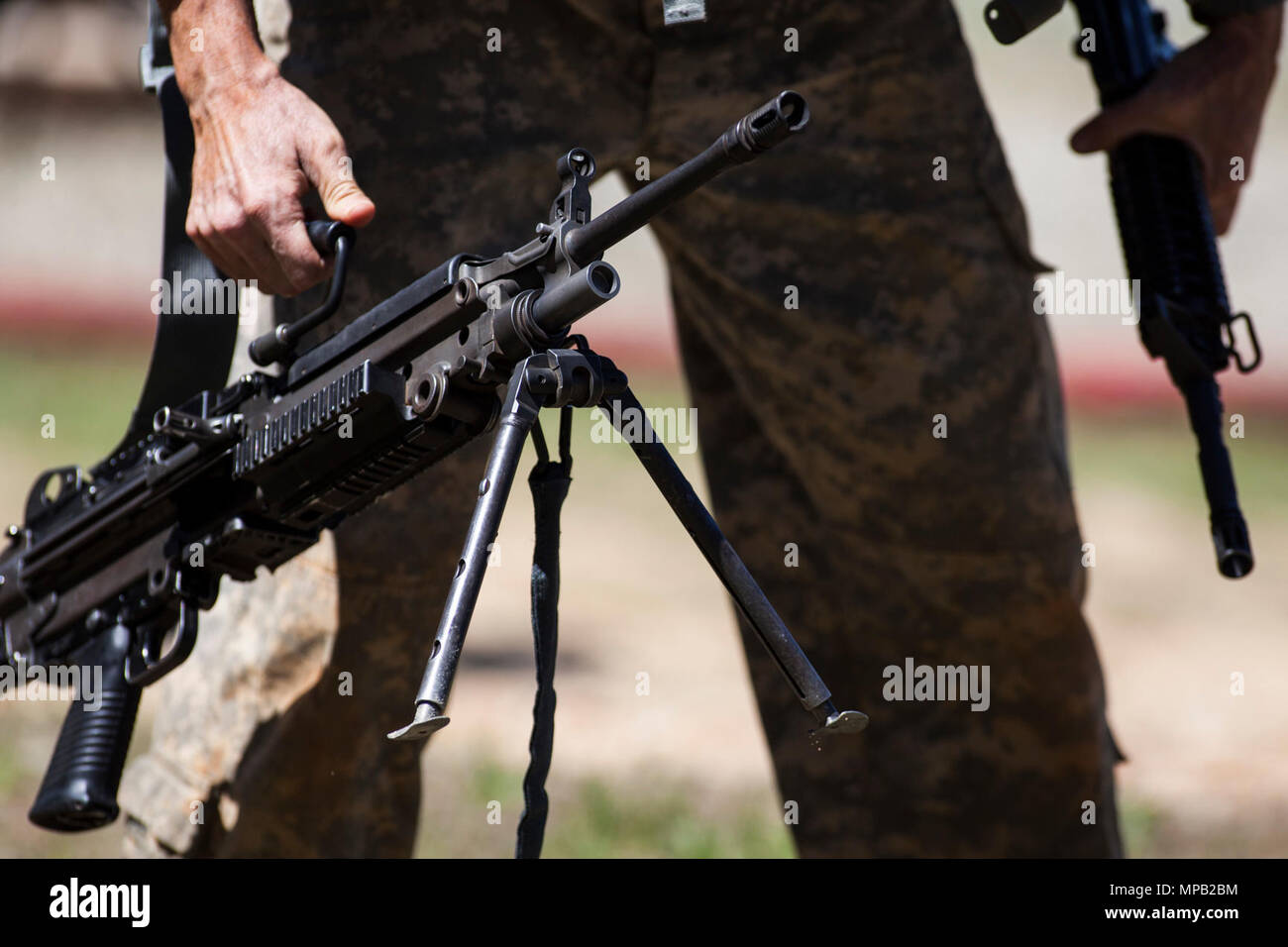 U.S. Army Ranger retrieves an M249 Squad Automatic Weapon in ...