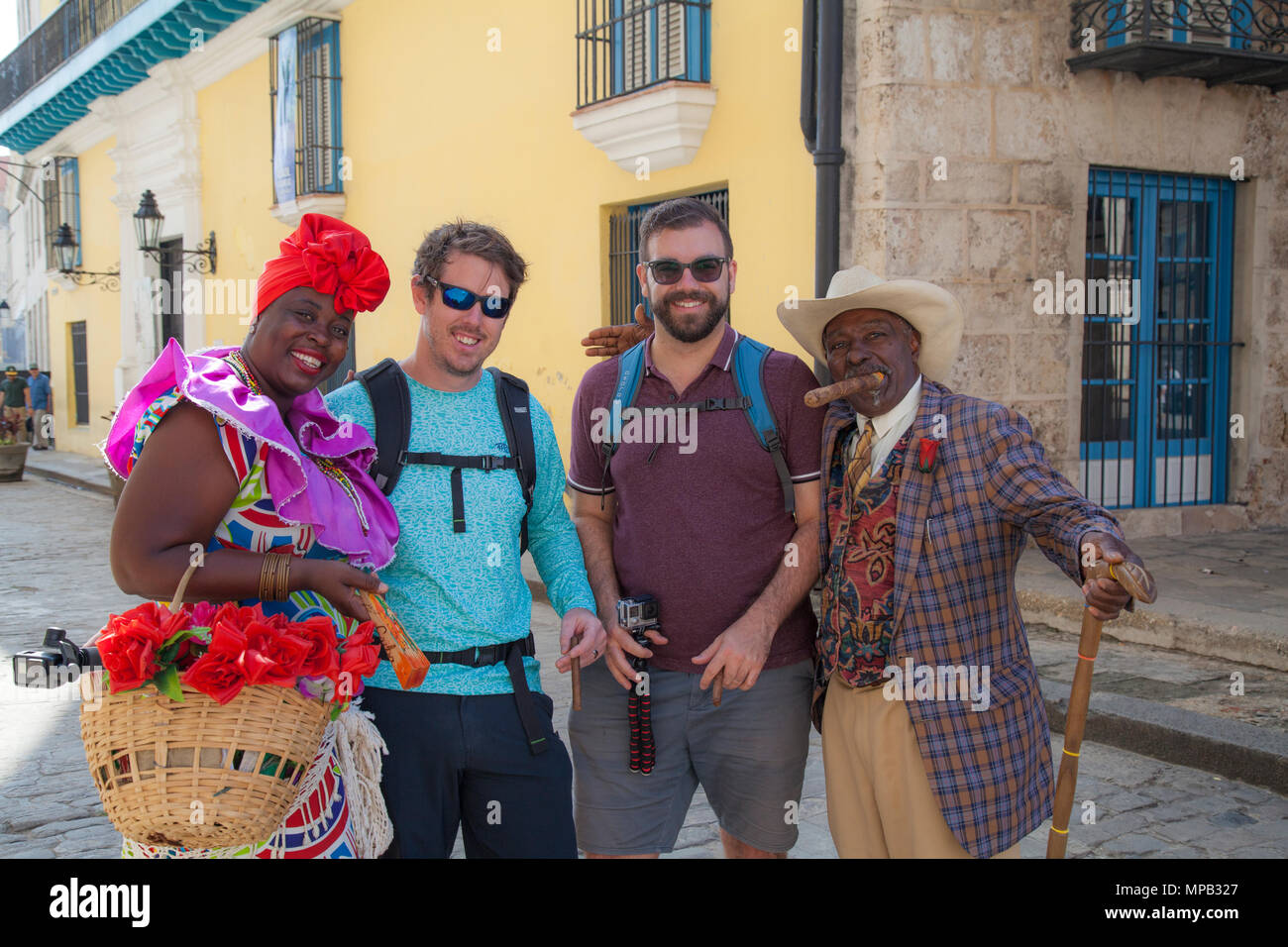 Tourists having fun with local cubans in Old Havana Cuba Stock Photo ...