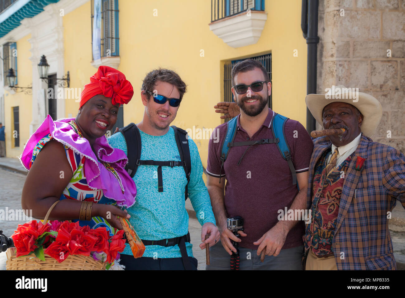 Tourists having fun with local cubans in Old Havana Cuba Stock Photo ...